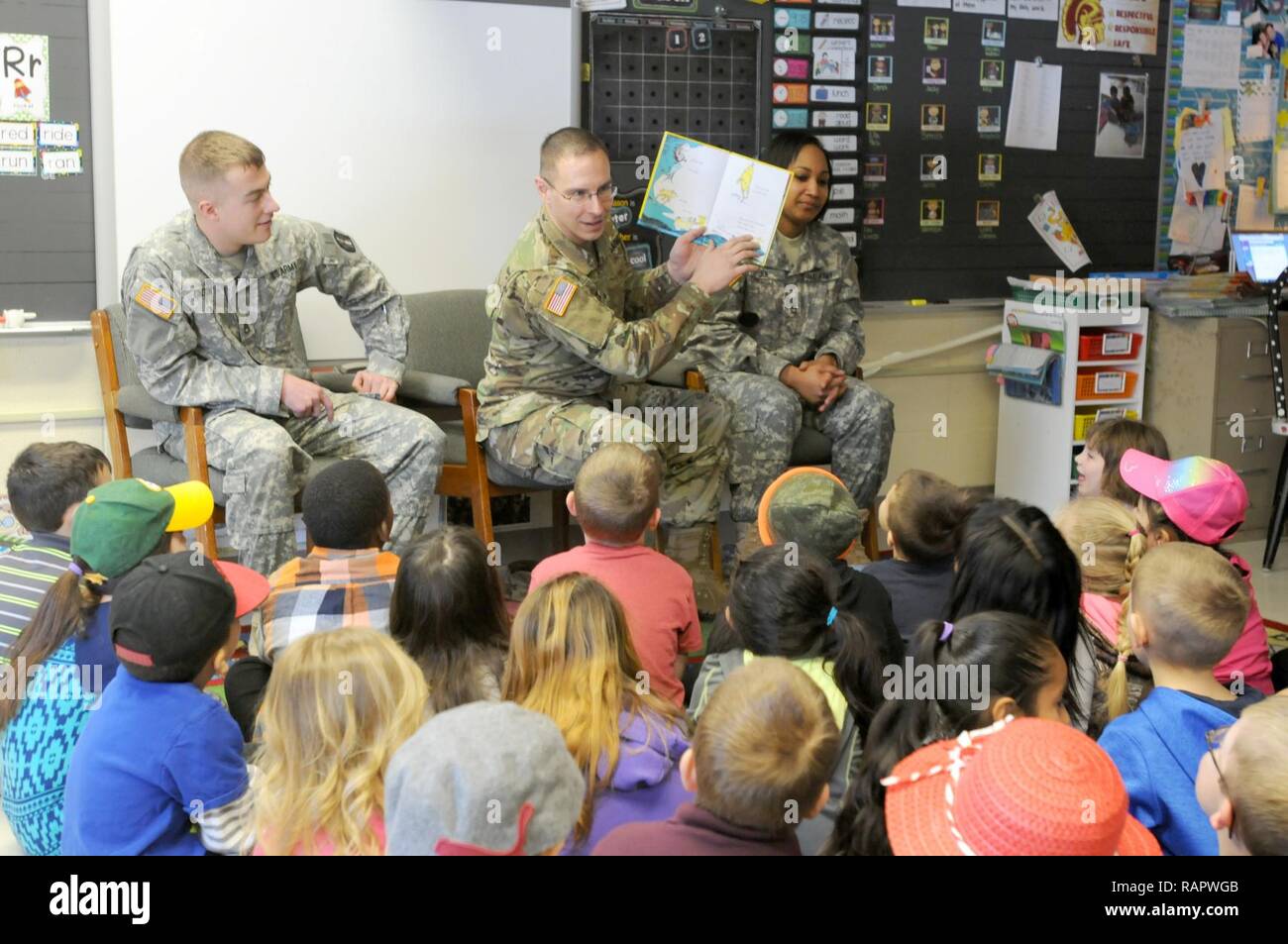 Sergeant Robert Clark, center, uses a pirate voice to read One Fish Two ...