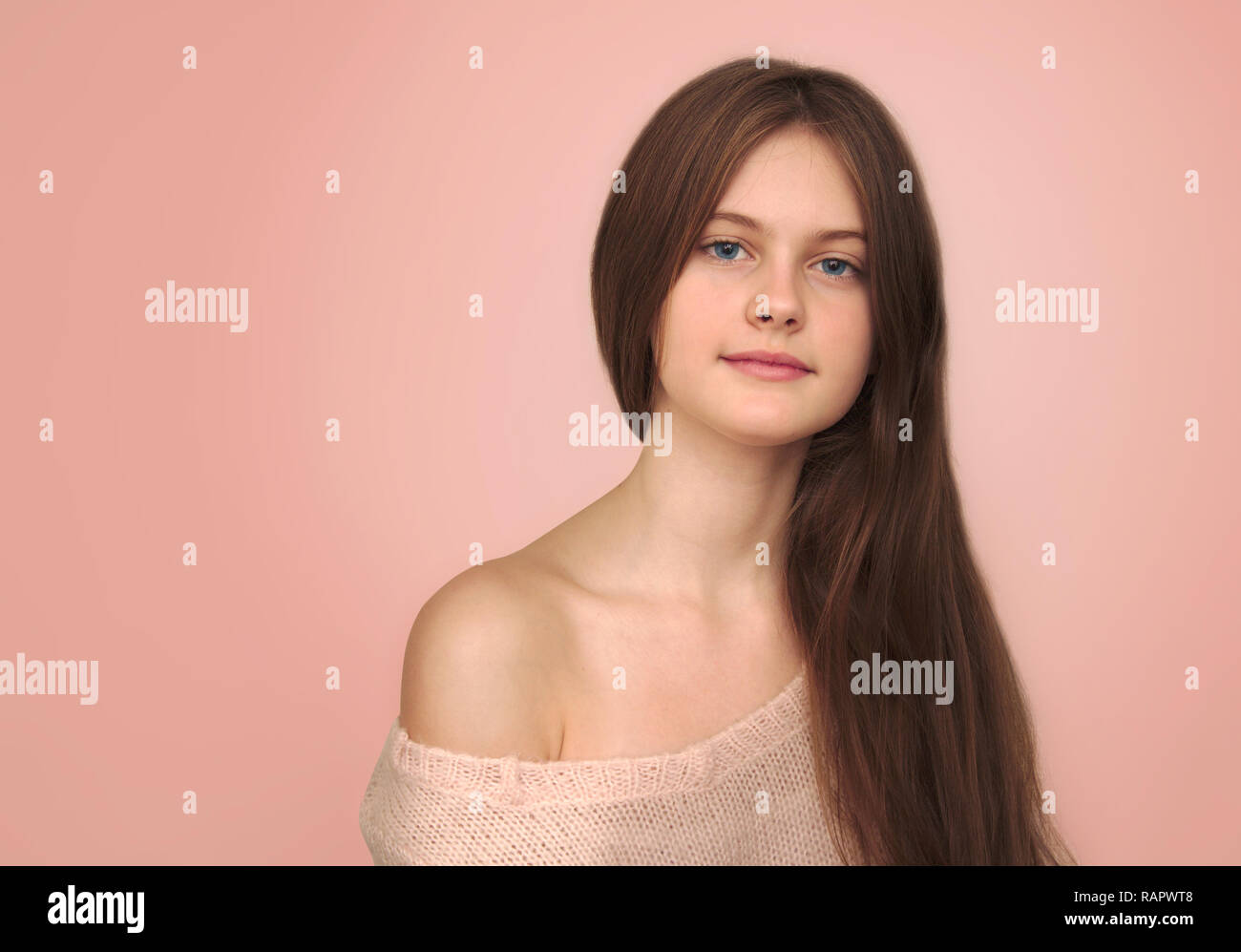 blue eyed brown haired shy girl with flowing hair Stock Photo - Alamy