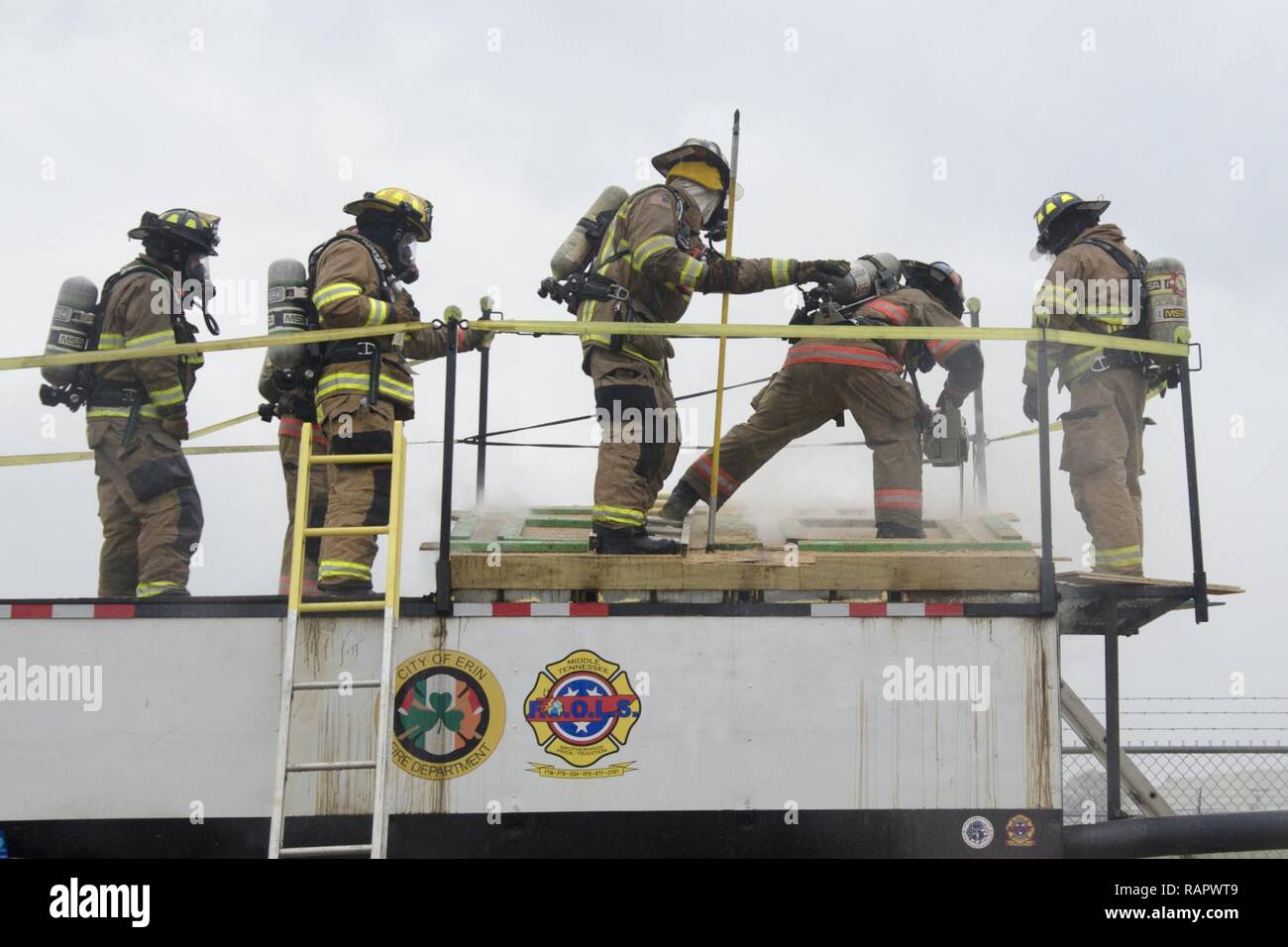 Firefighters perform vertical ventilation training at the second annual ...