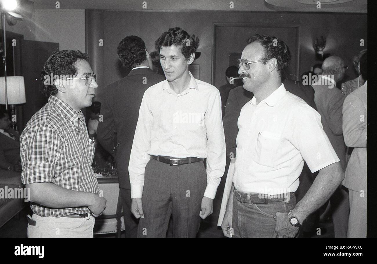 THREE MEN TALKING TO EACH OTHER Stock Photo - Alamy