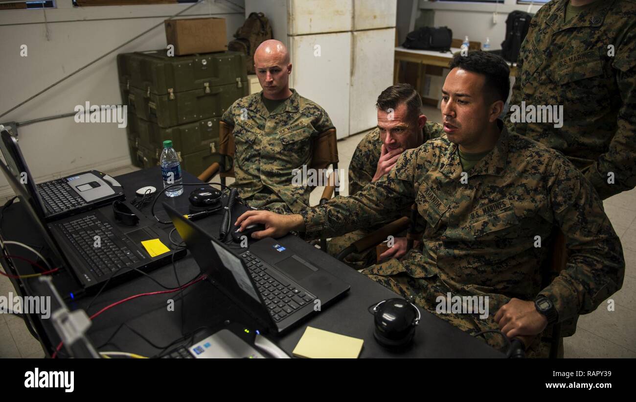 U.S. Marines assigned to Marine Air Support Squadron 6 listen in on ...