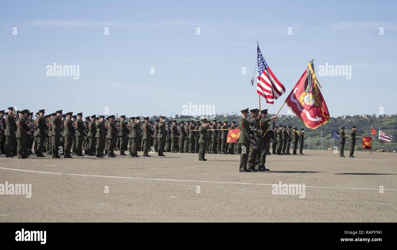 U.S. Marines with the 5th Marine Regiment, 1st Marine Division salute ...