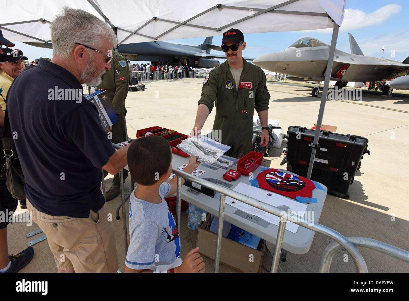 Geelong, AUSTRALIA – A U.S. Air Force first lieutenant hands out an F ...