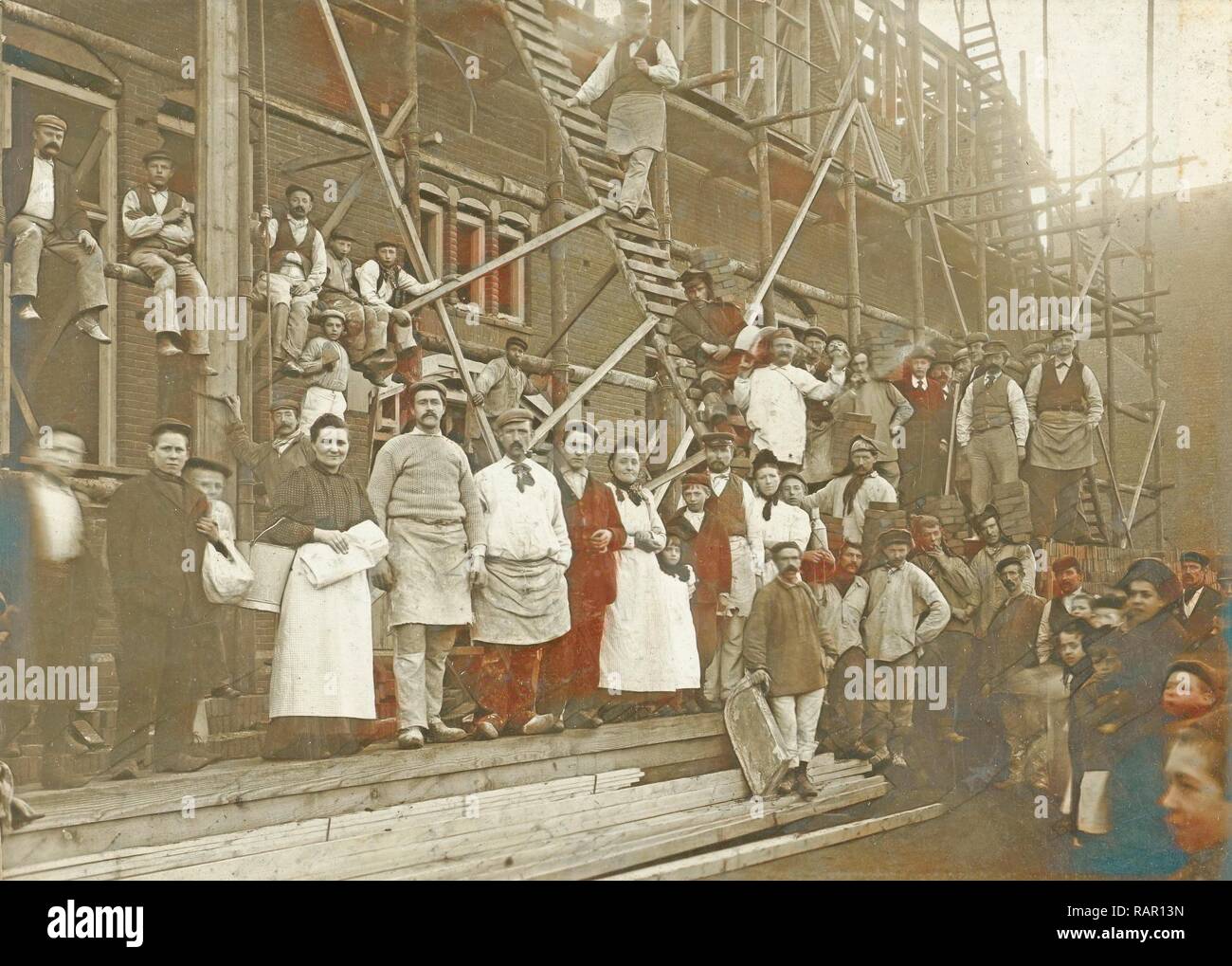 Group portrait of workers at a house under construction, Centraal ...