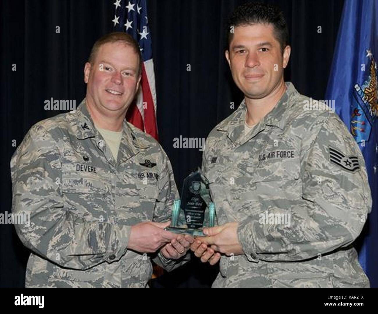Staff Sgt. Sean Bird (right), a 302nd Airlift Wing reservist assigned ...