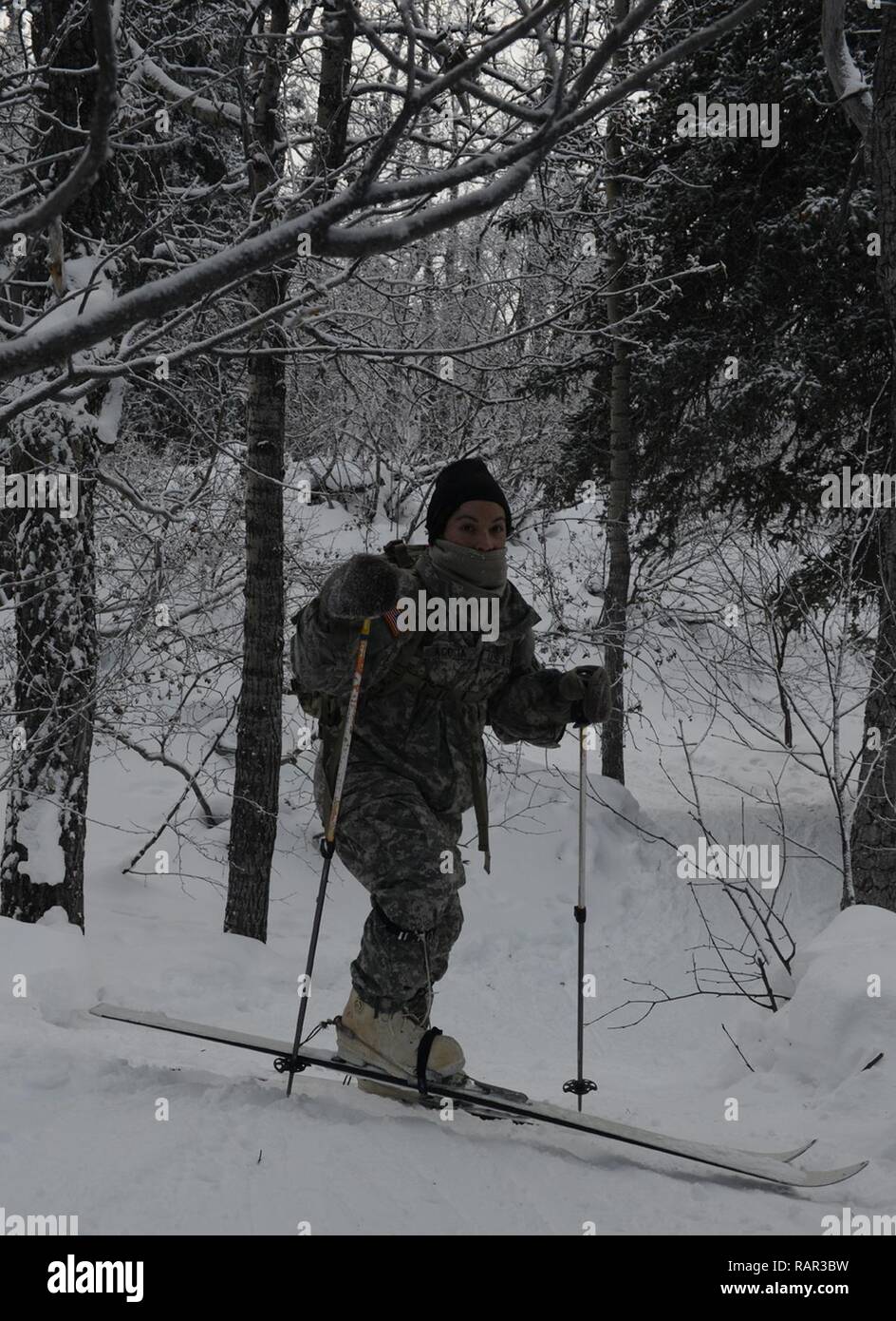 A student side-steps her way up a hill during the bivouac portion of ...