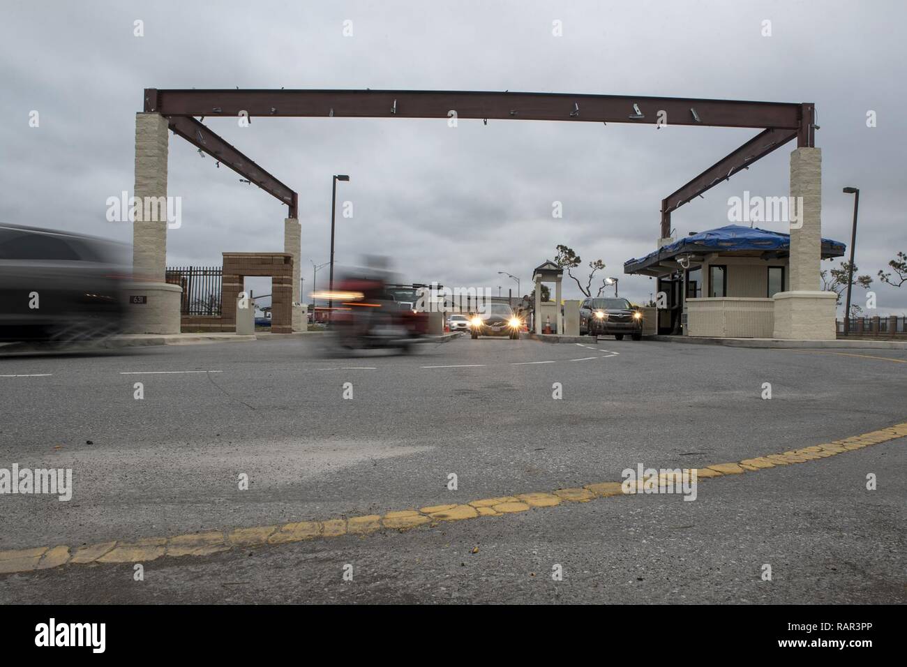 Members of Team Tyndall drive through the Airey Gate at Tyndall Air ...