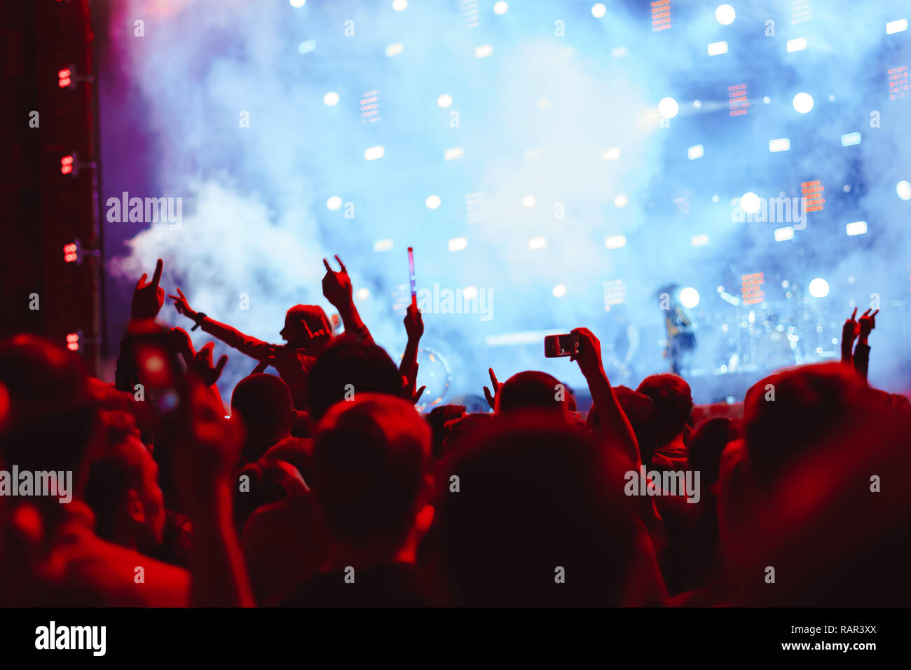 Effects blur Concert, disco dj party. People with hands up having fun ...