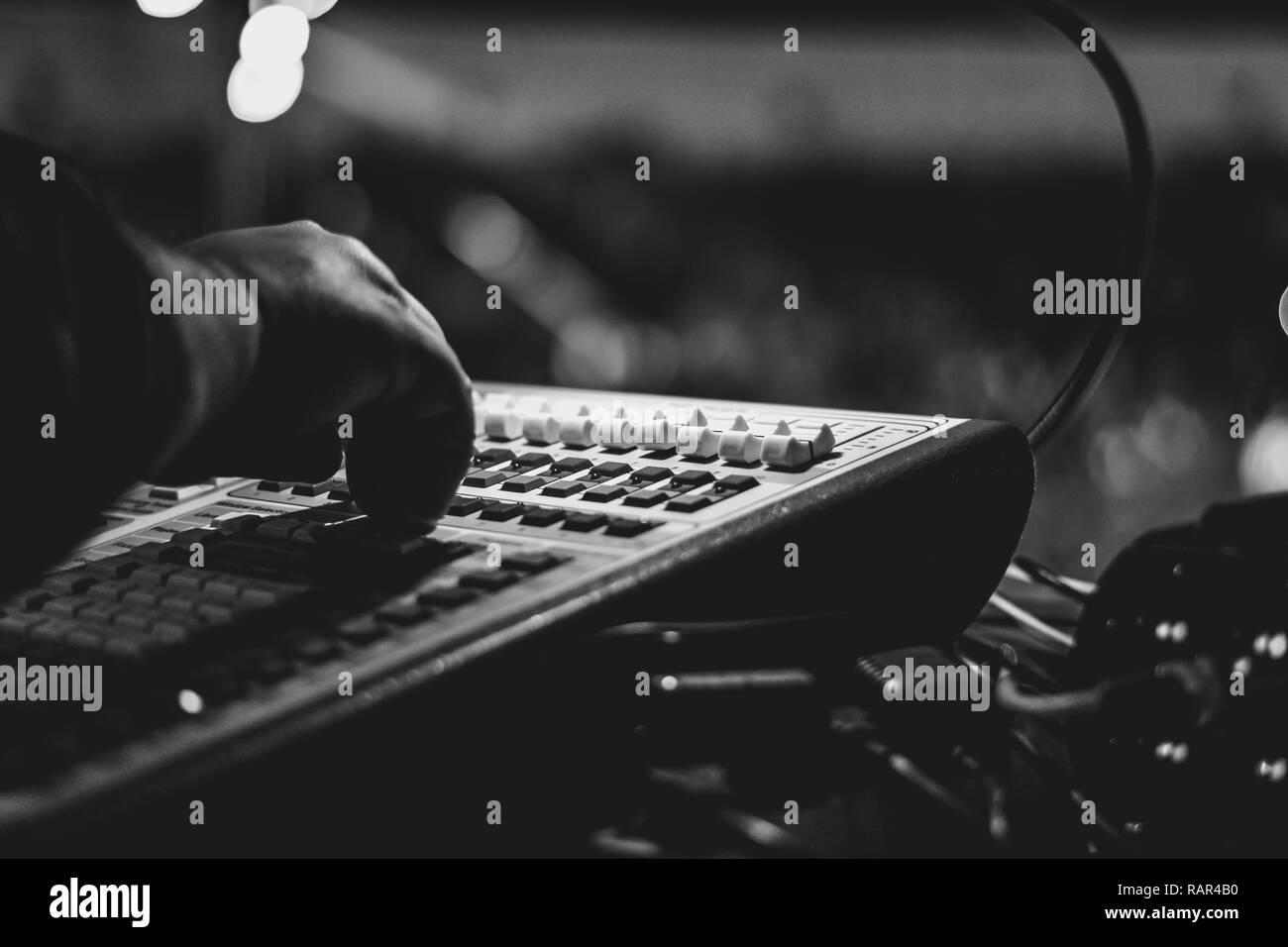 The hands of the sound engineer on the mixing console Stock Photo - Alamy