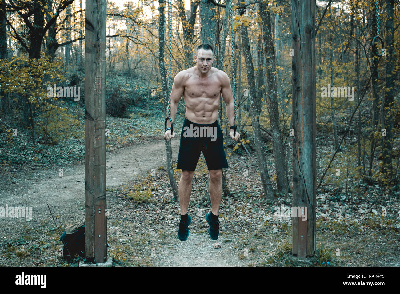 Powerful bodybuilder with perfect naked upper body with six-pack ...