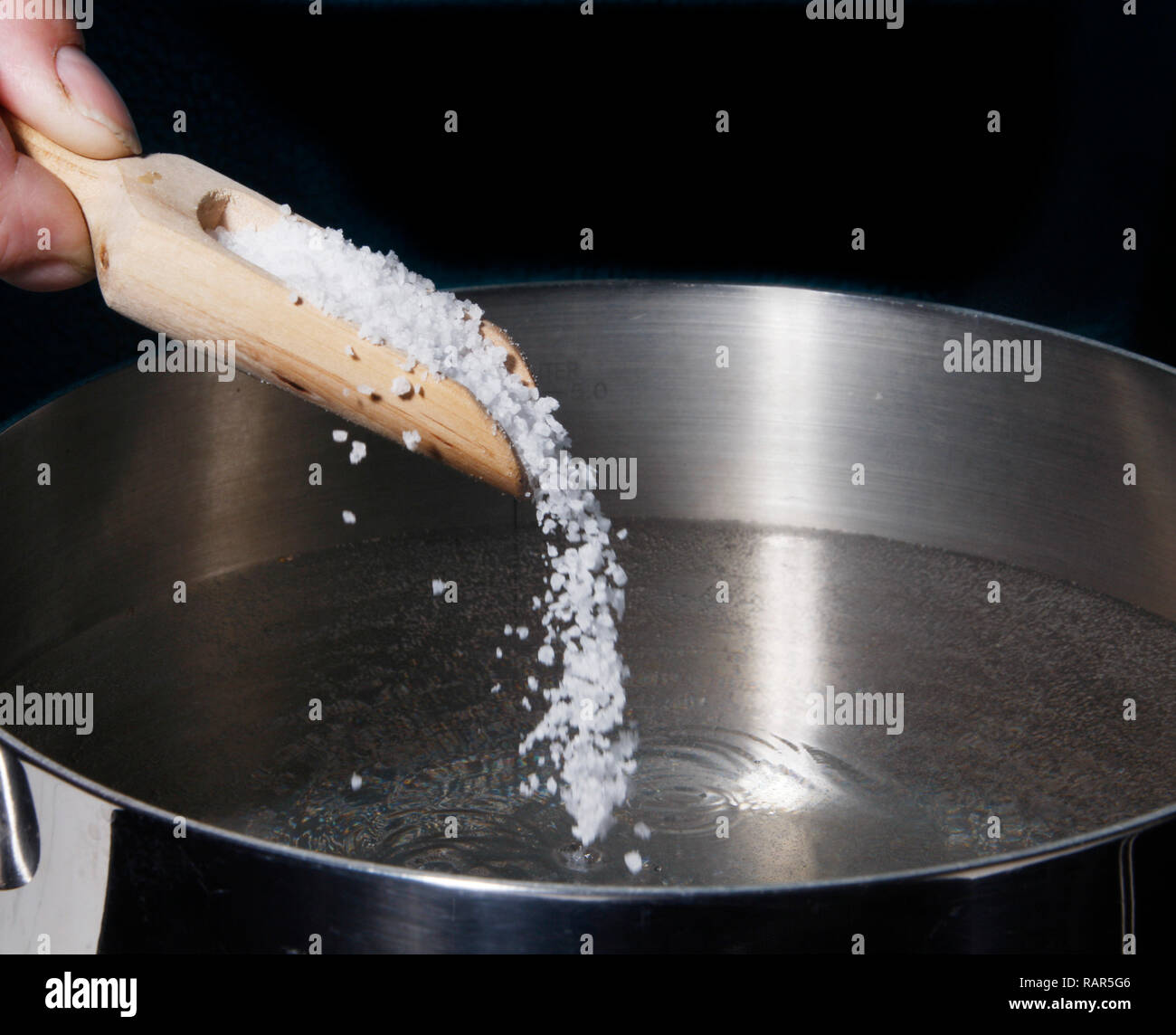 Adding Salt into Water Stock Photo - Alamy