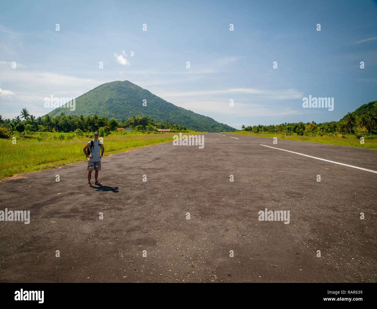Standing alone at airplane runaway at Banda island, Indonesia, Asia ...