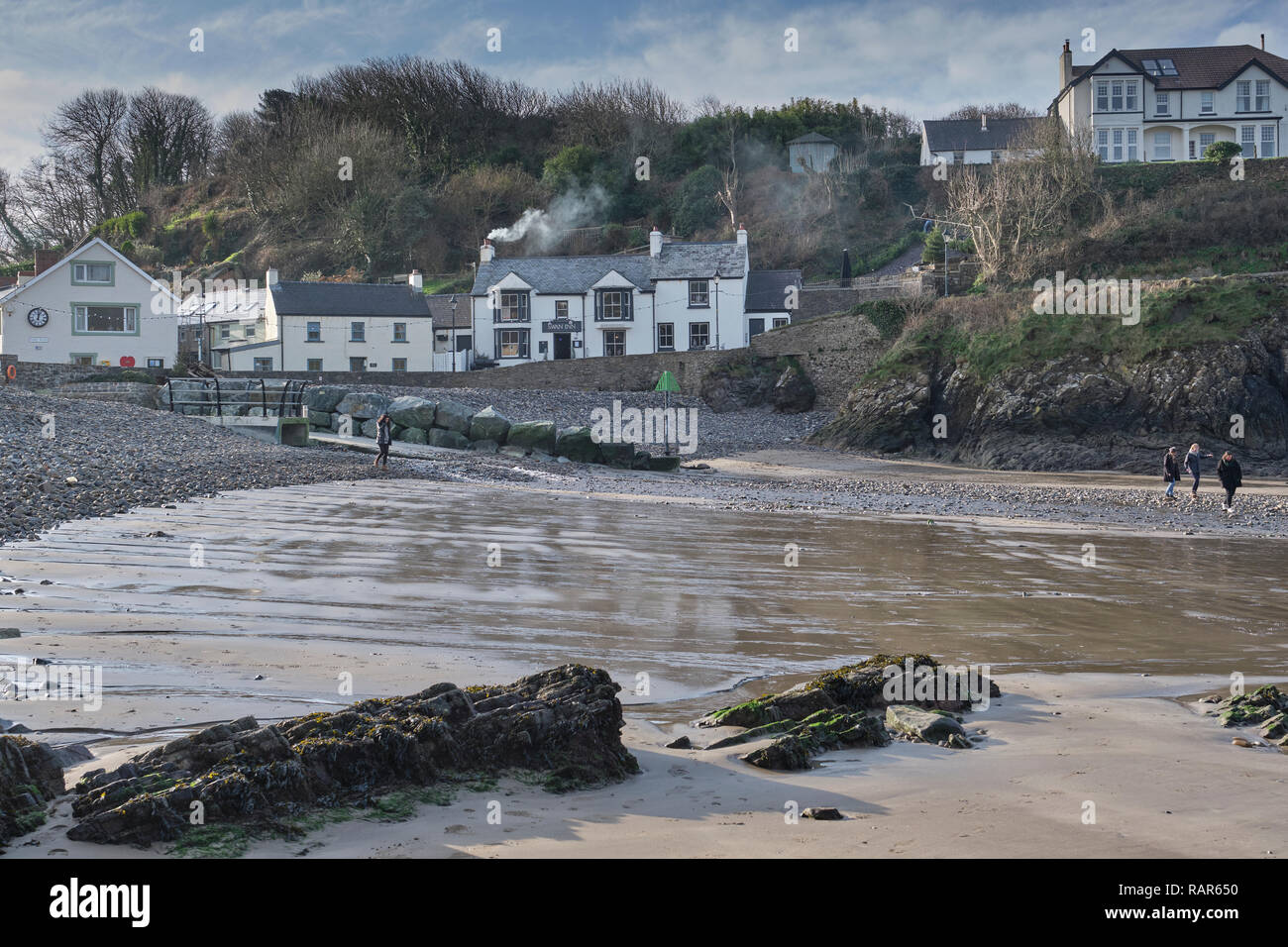 View of The Swan Inn taken from Little Haven beach, Pembrokeshire ...