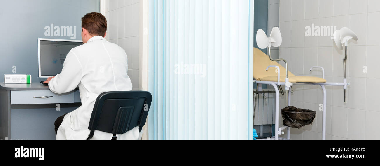 Doctor typing and using his computer in the office. Modern hospital ...