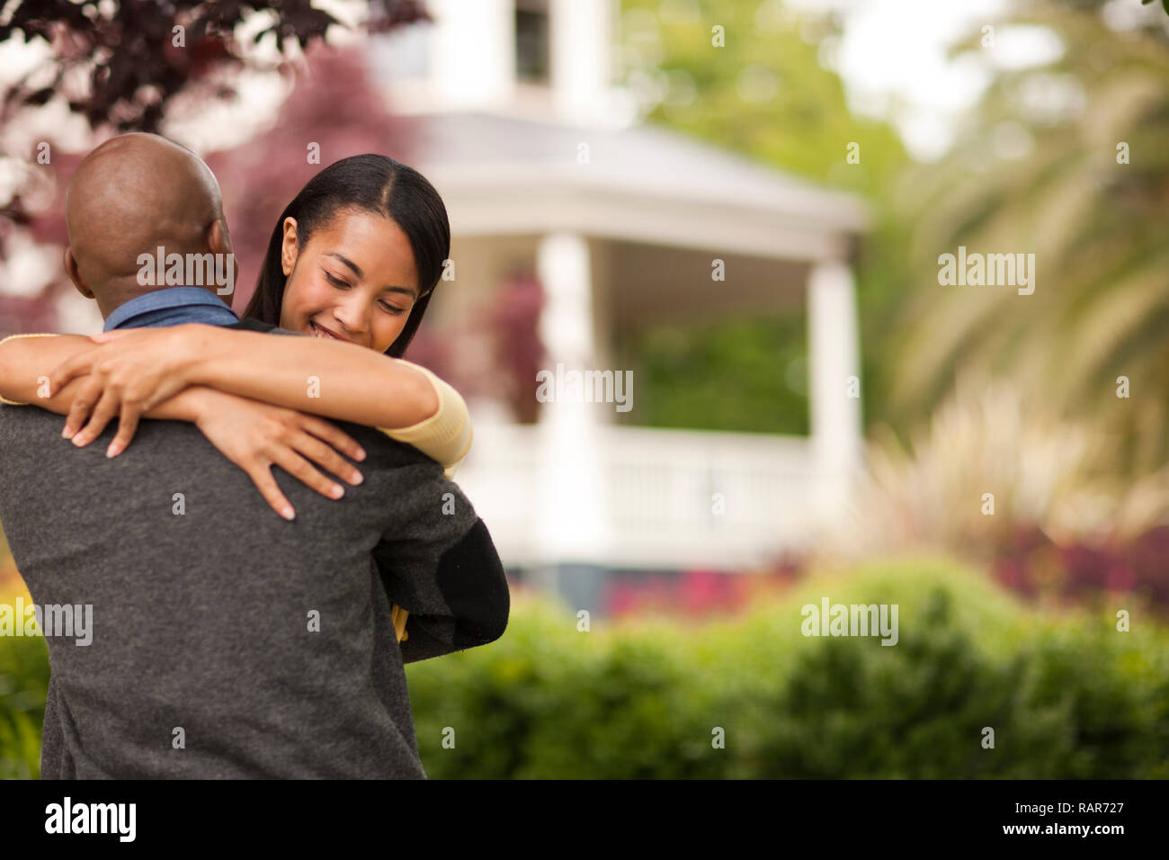 Couple greeting each other on the street Stock Photo - Alamy
