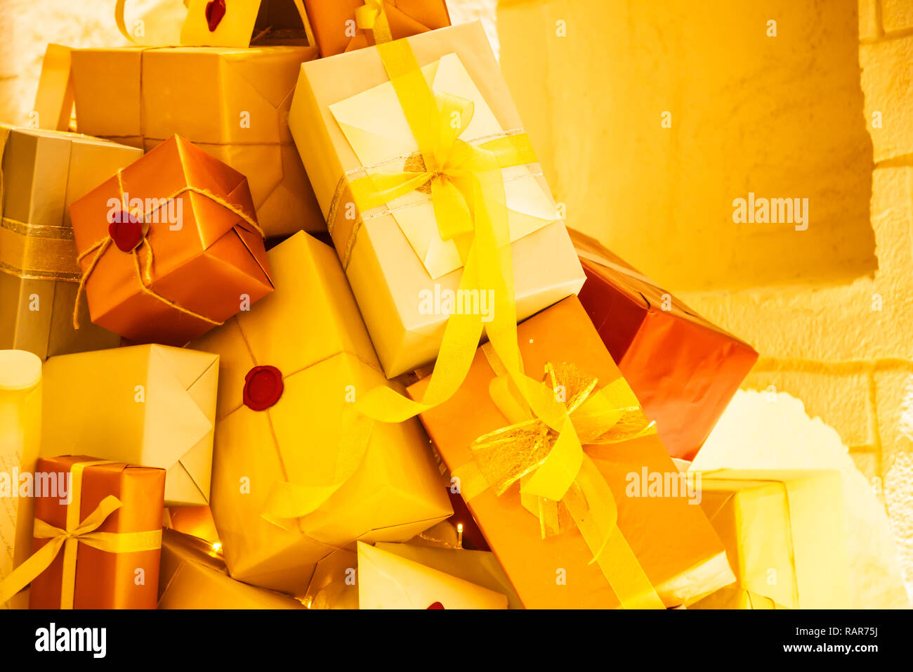 gold present boxes package with silver ribbons as holiday gift boxes ...