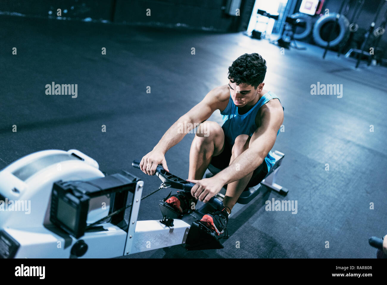 Man on rowing machine hi-res stock photography and images - Alamy