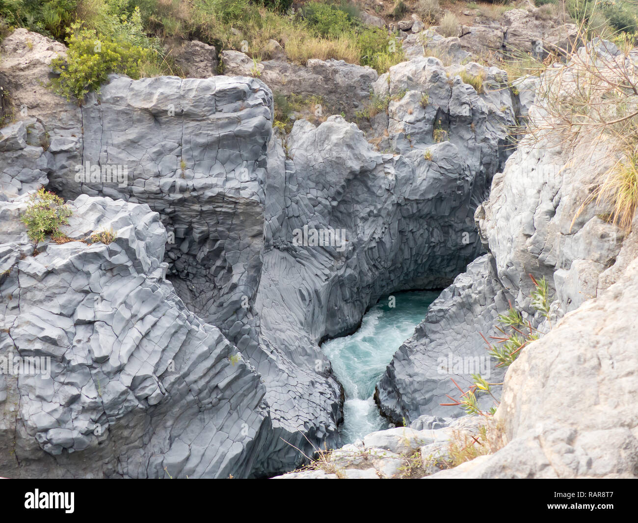 Sicily: basalt rock formations in the Alcantara Gorge near Taormina ...