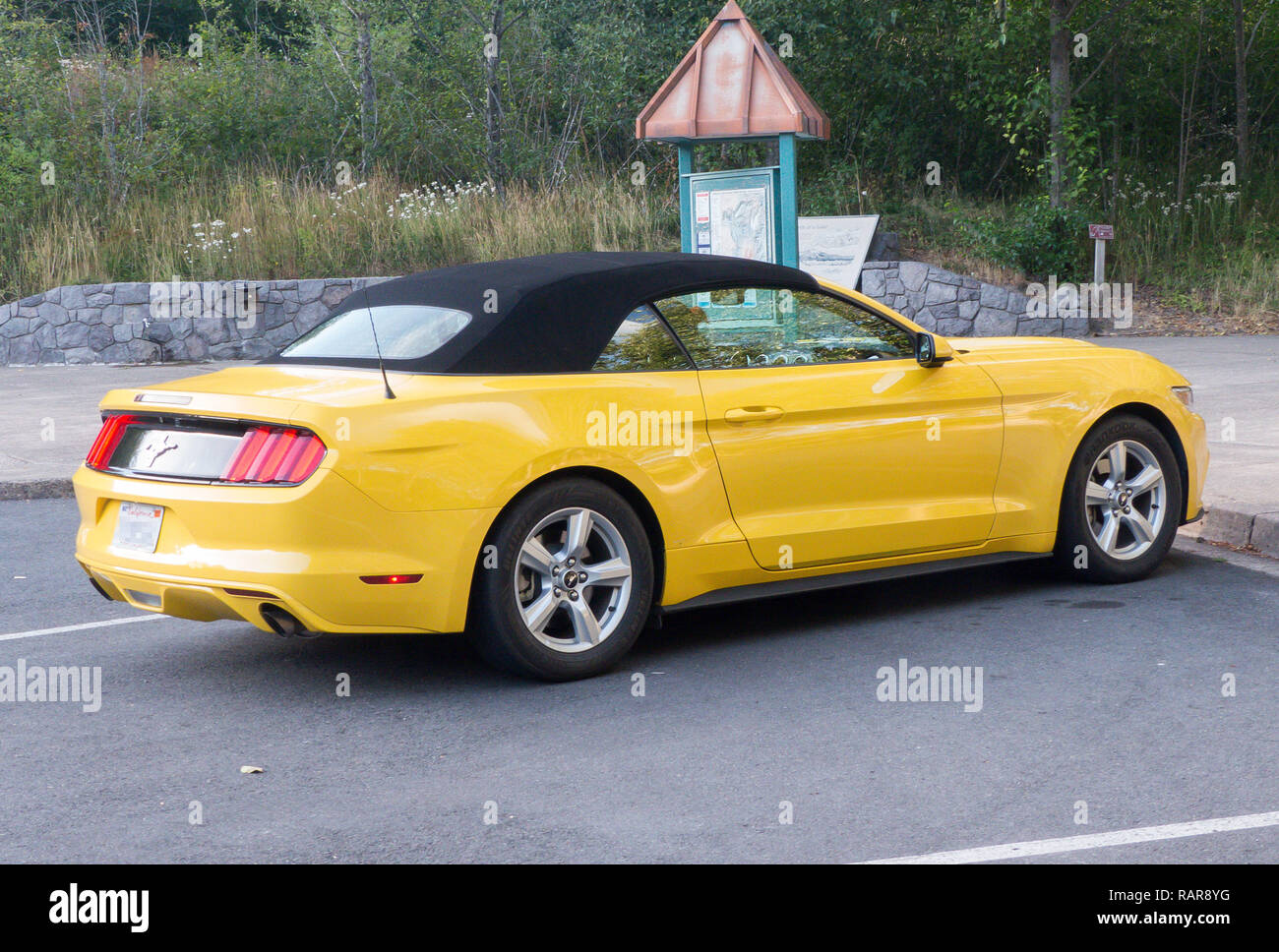 A yellow convertible 2017 Ford Mustang Stock Photo - Alamy