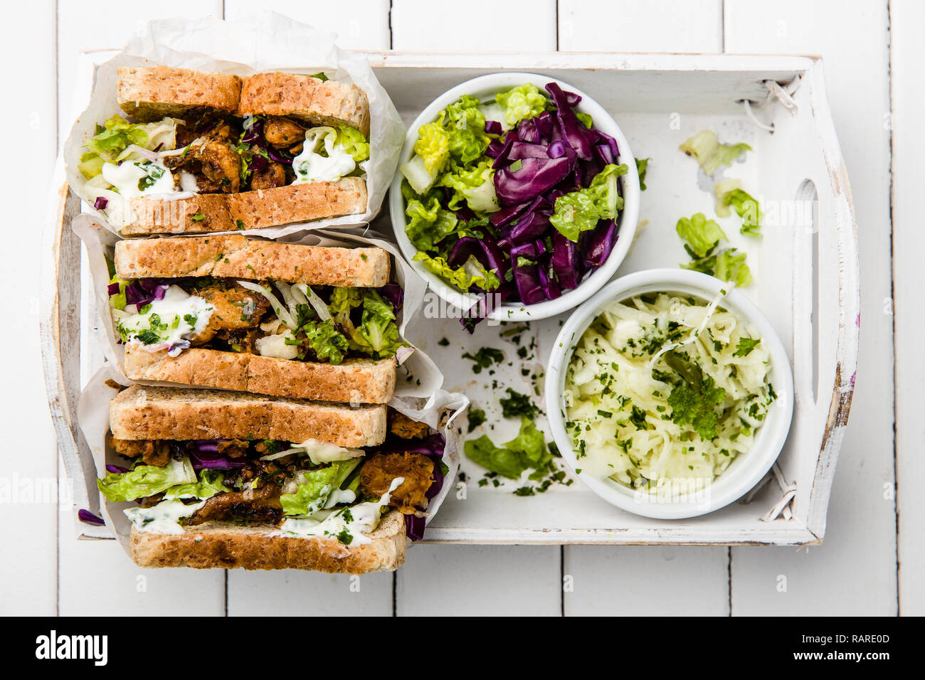 delicious gyros sandwich in paper bag with salad and tzatziki, top view ...