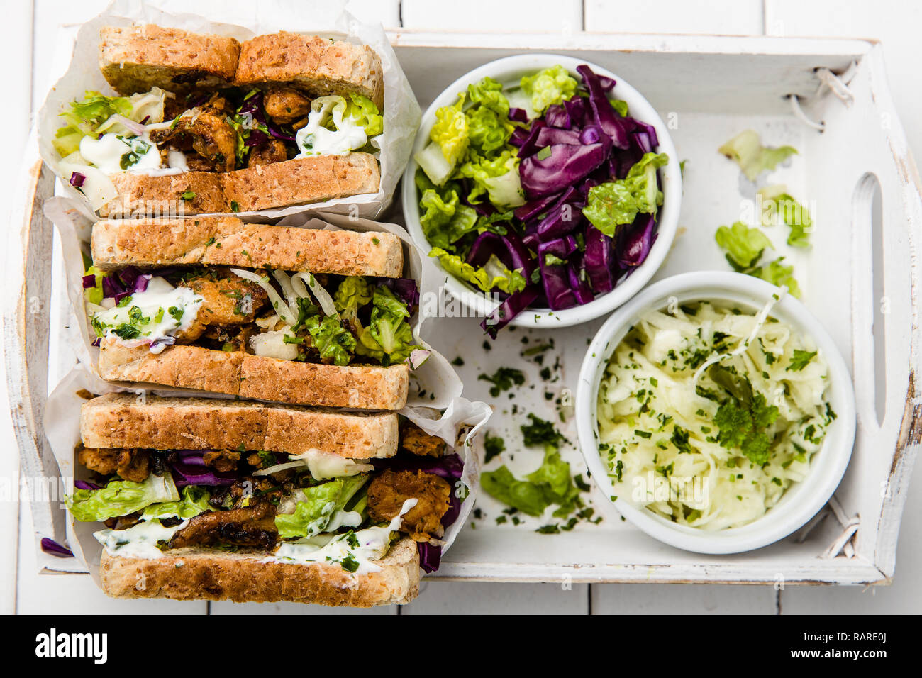 delicious gyros sandwich in paper bag with salad and tzatziki, top view ...