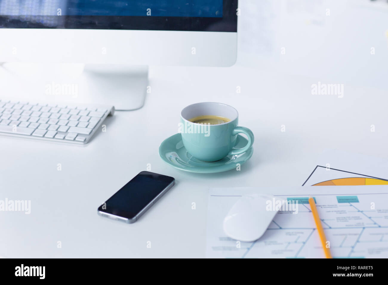 A cup of coffee on the office table Stock Photo - Alamy