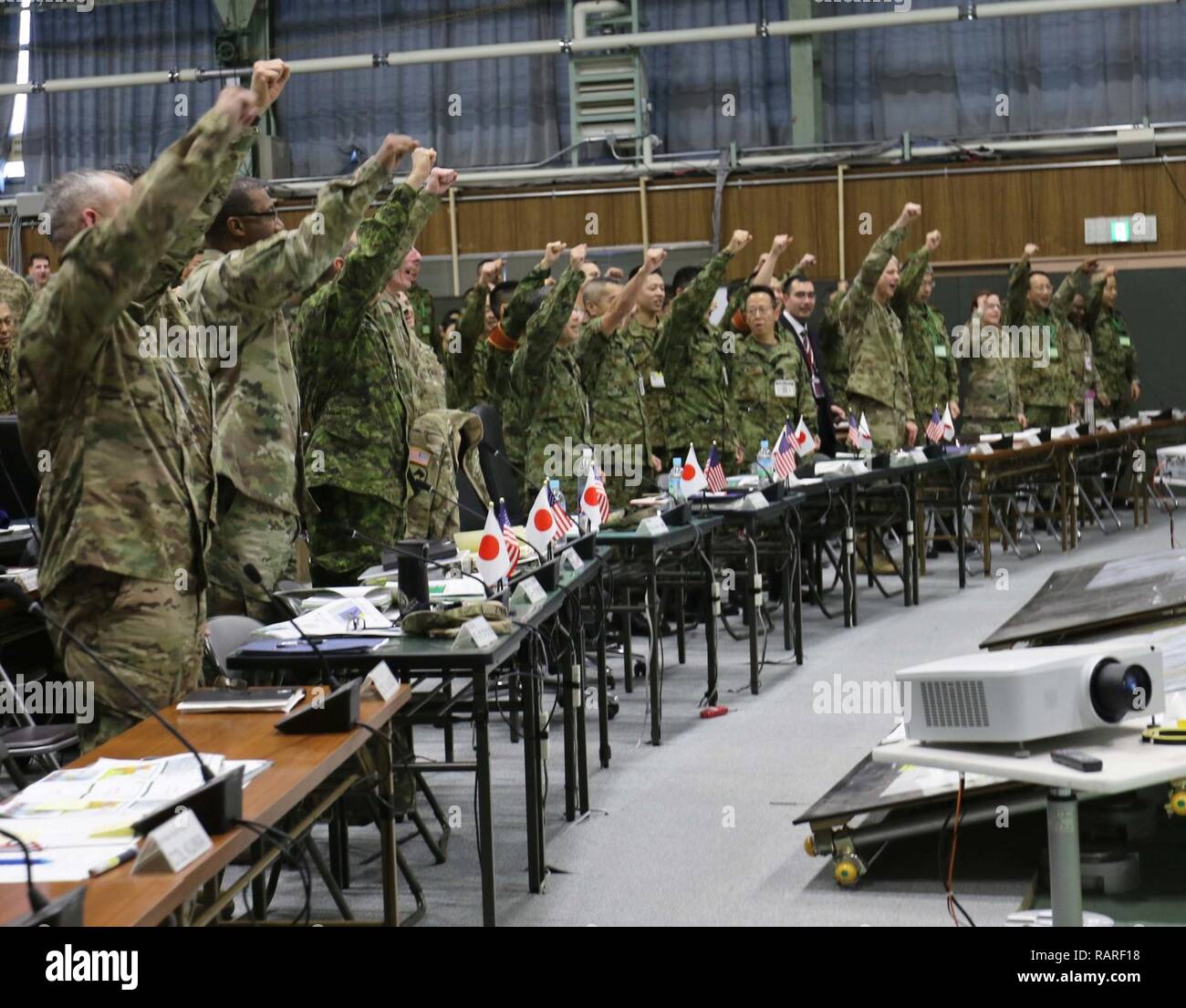 Leaders with the U.S. Army and the Japan Northern Army raise their ...