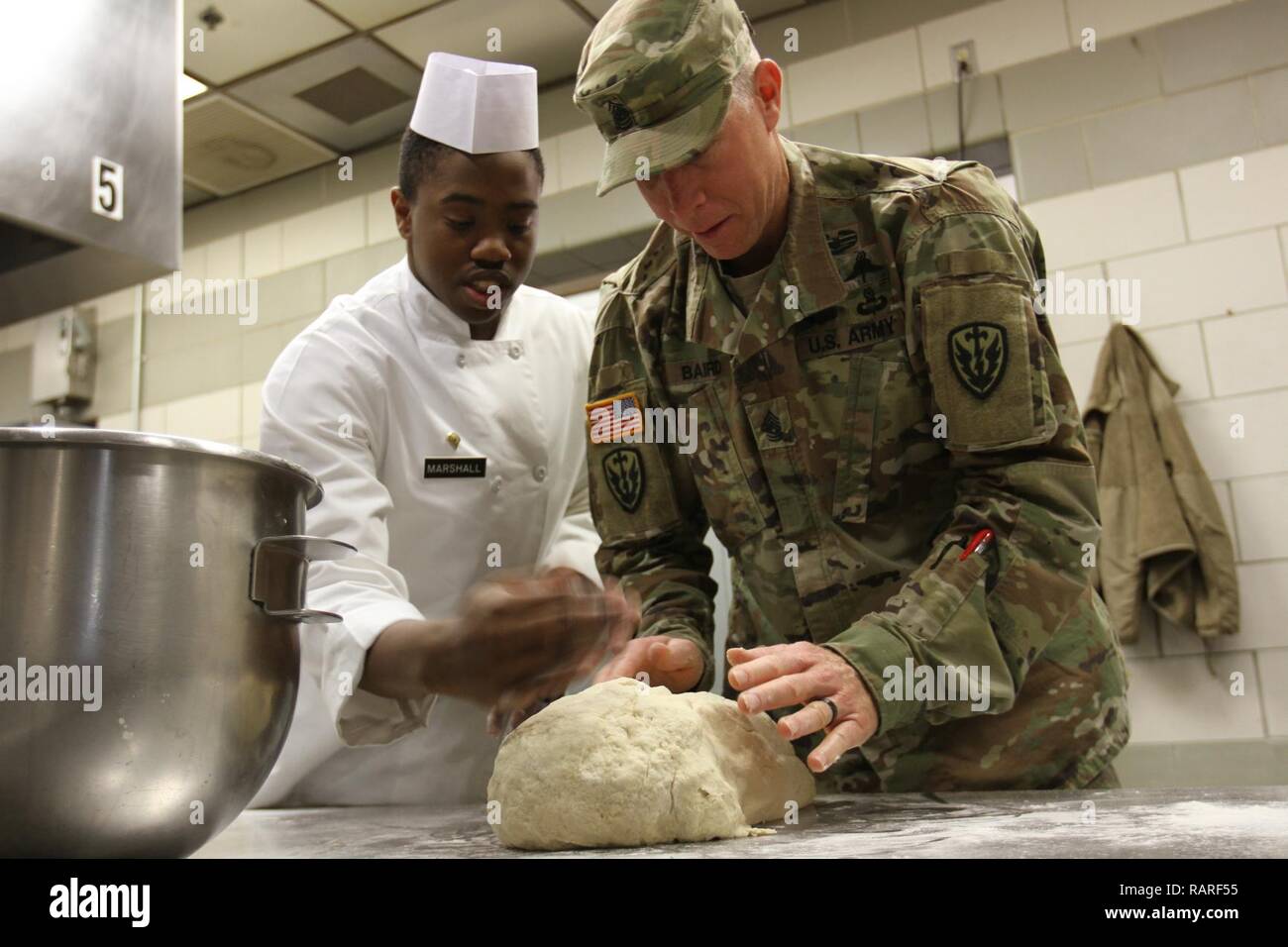 Spc. Tervaris Marshall, left, 303rd Military Intelligence Battalion ...