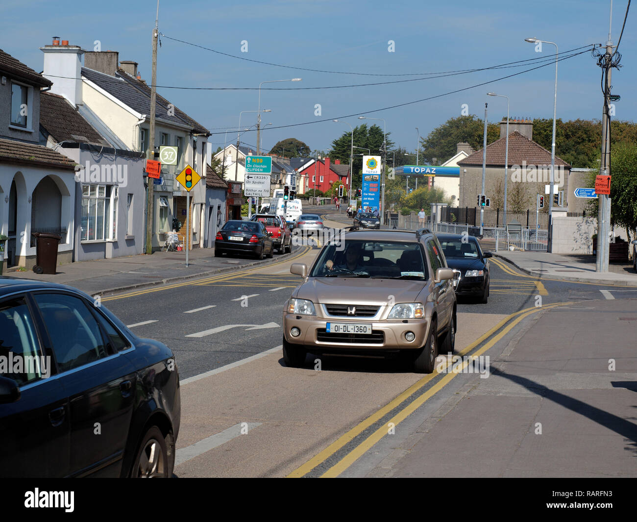 Traffic approaching Galway City on Lower Newcastle Road with Distillery ...