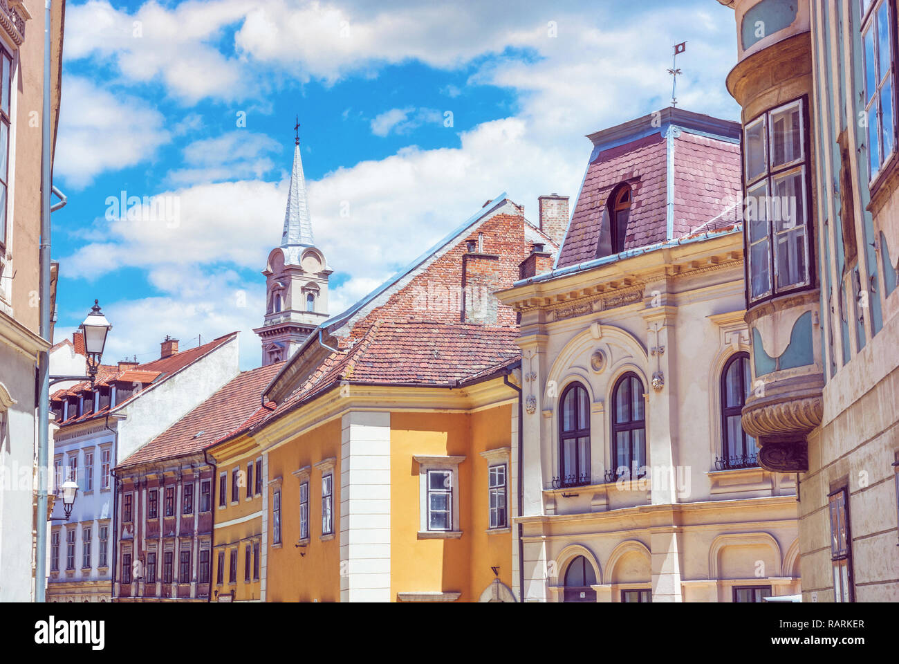 Historic buildings and church tower in Sopron, Hungary. Architectural ...
