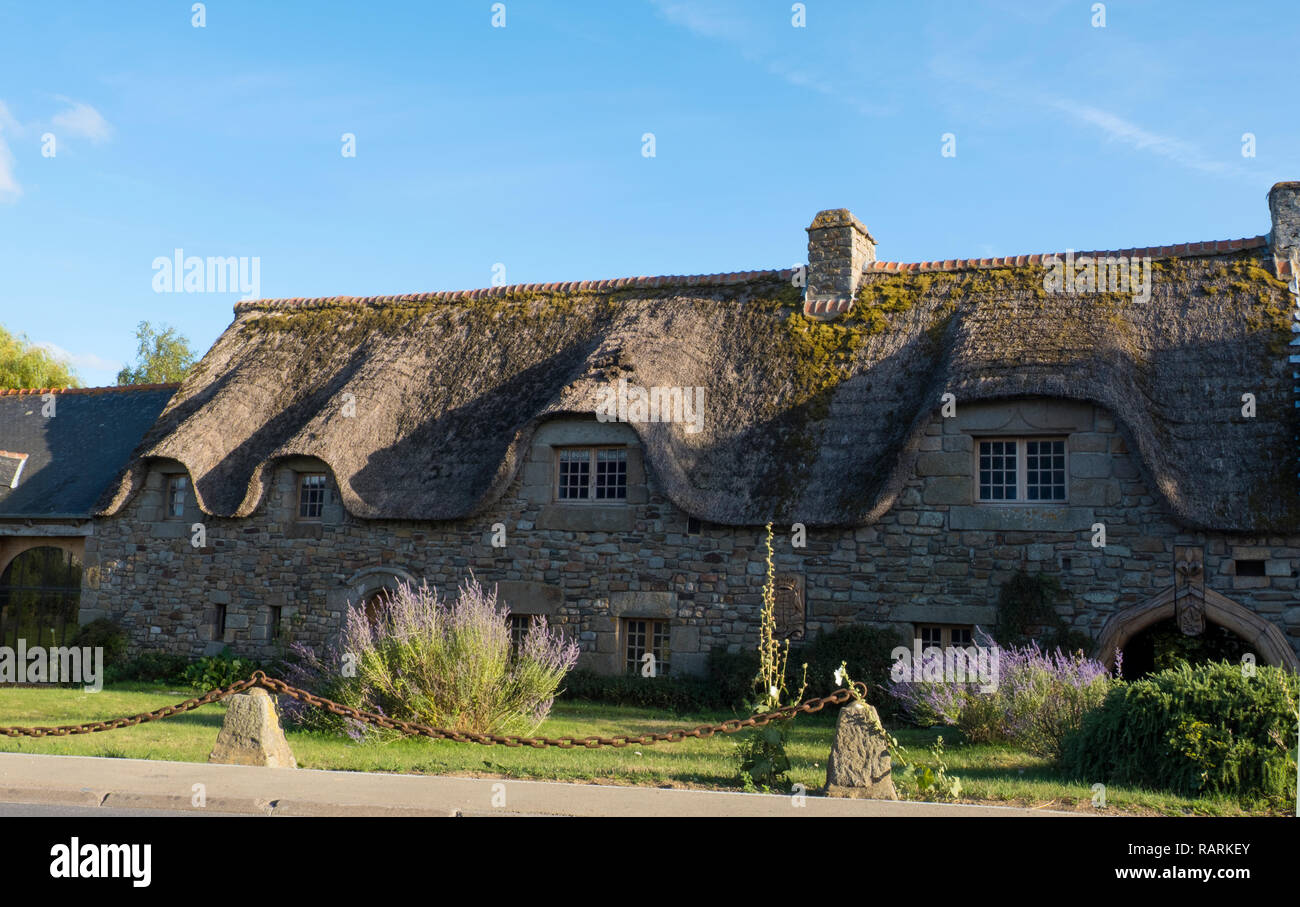 Old beautiful traditional stone house with thatched roof in Brittany ...