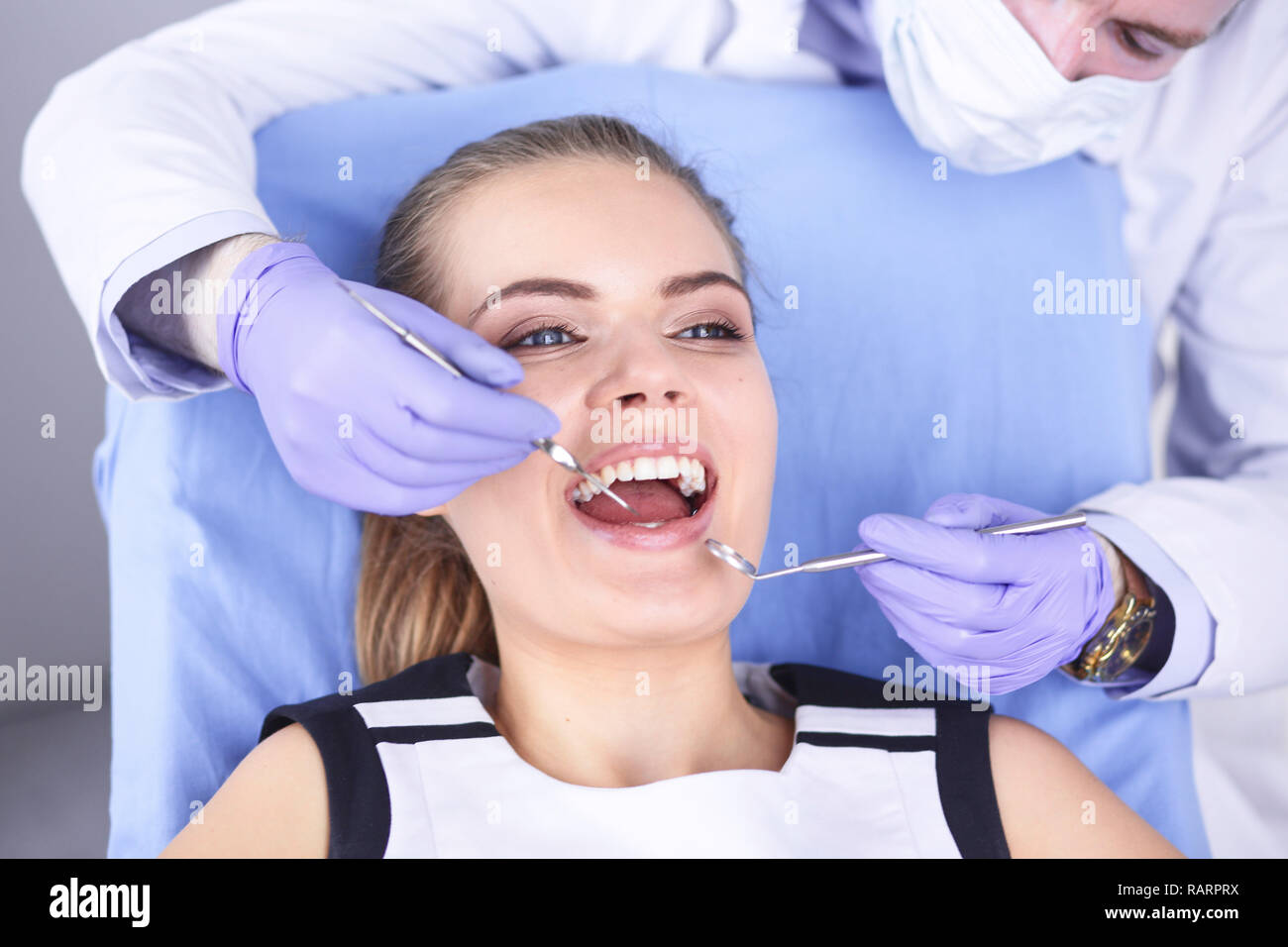 beautiful girl in the dental chair on the examination at the dentist ...