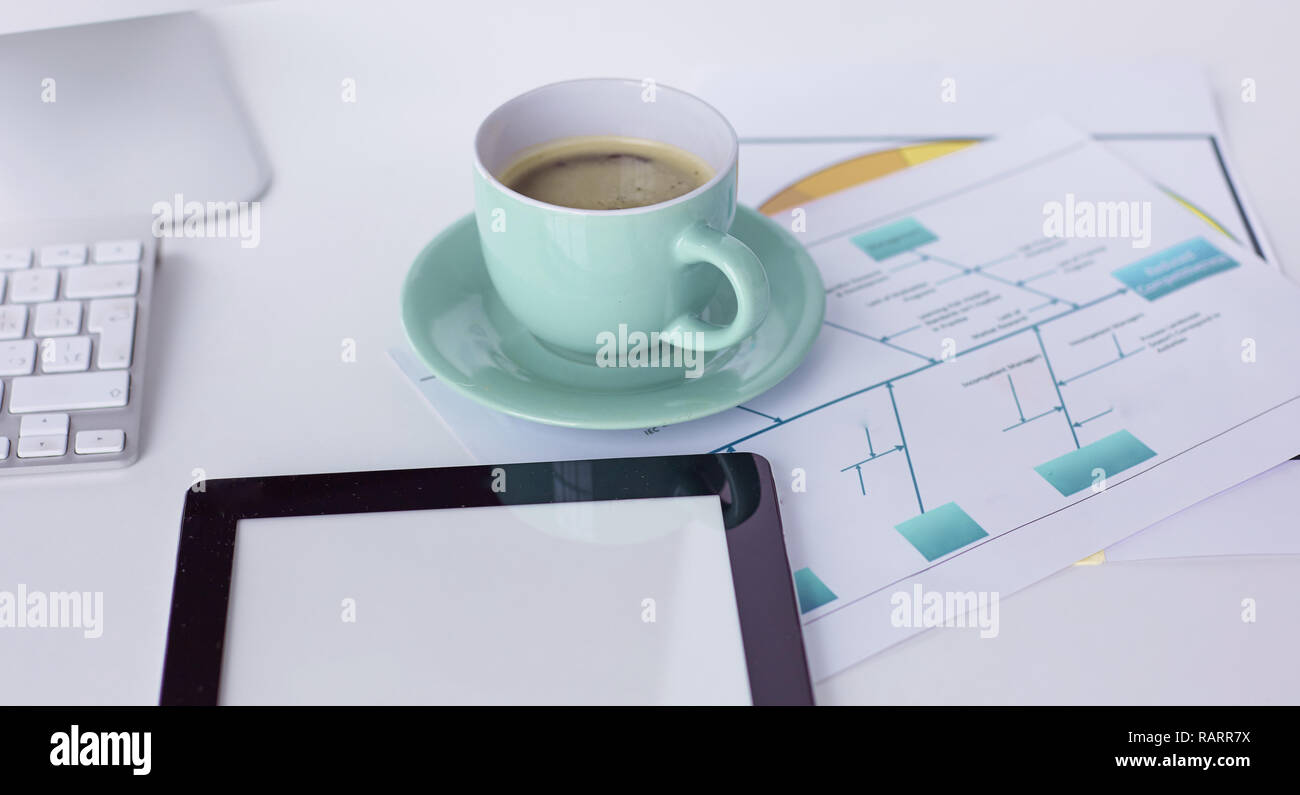 A cup of coffee on the office table Stock Photo - Alamy
