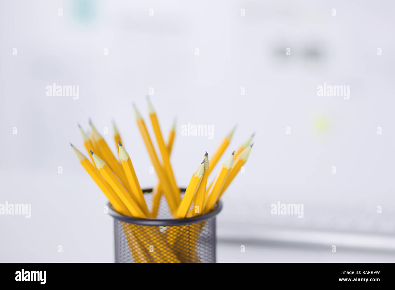 Graphite pencils in a metal grid-container. Concept Stock Photo - Alamy