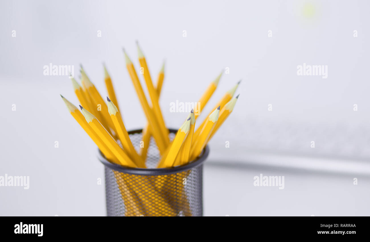 Graphite pencils in a metal grid-container. Concept Stock Photo - Alamy
