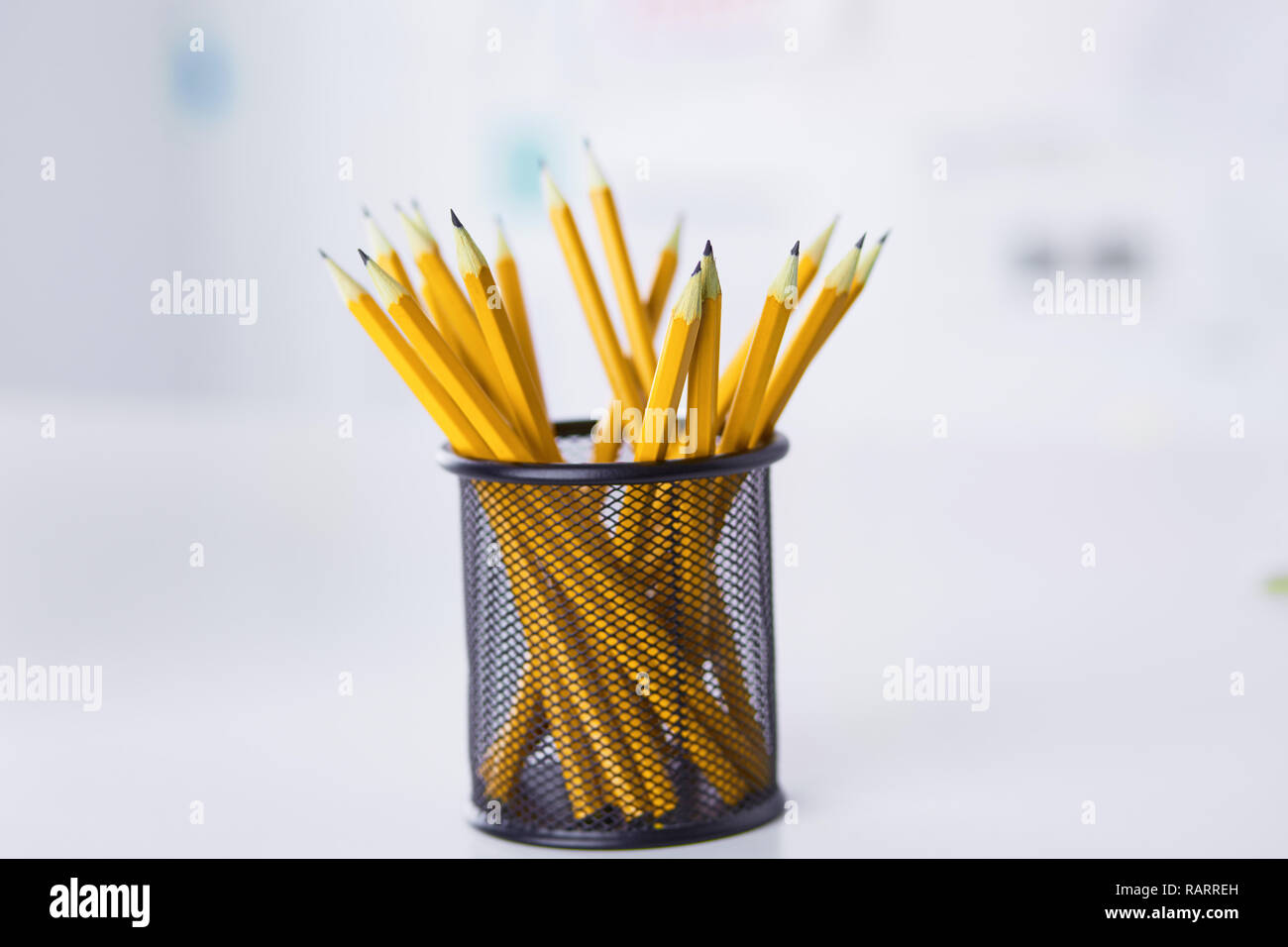 Graphite pencils in a metal grid-container. Concept Stock Photo - Alamy