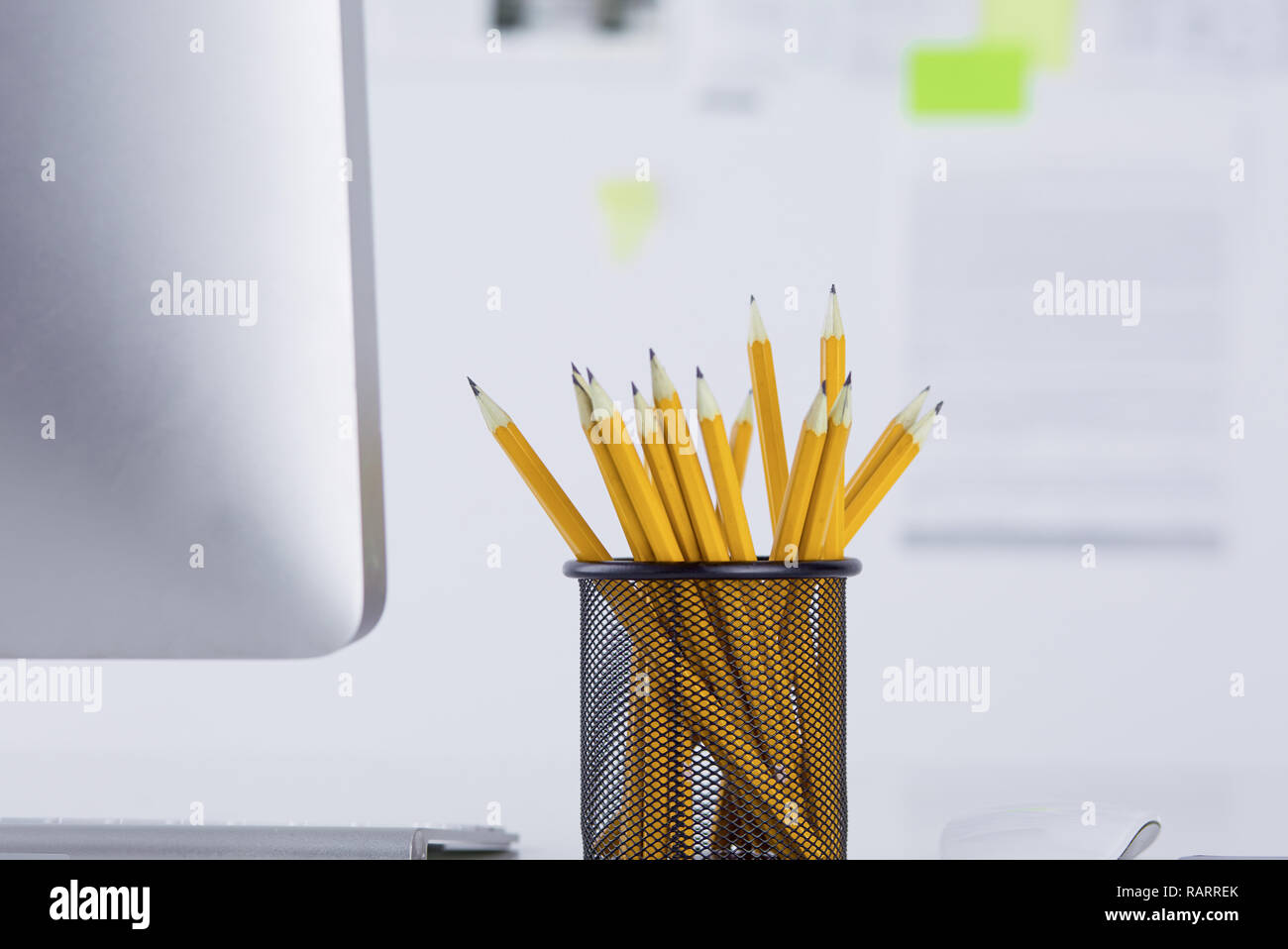 Graphite pencils in a metal grid-container. Concept Stock Photo - Alamy