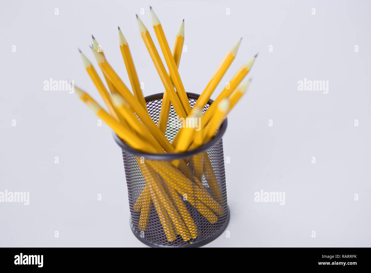 Graphite pencils in a metal grid-container. Concept Stock Photo - Alamy