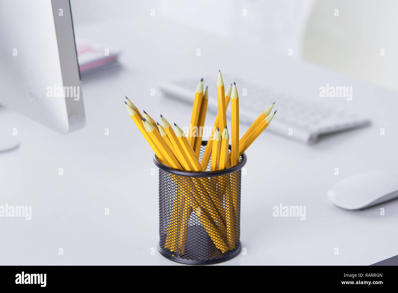 Graphite pencils in a metal grid-container. Concept Stock Photo - Alamy