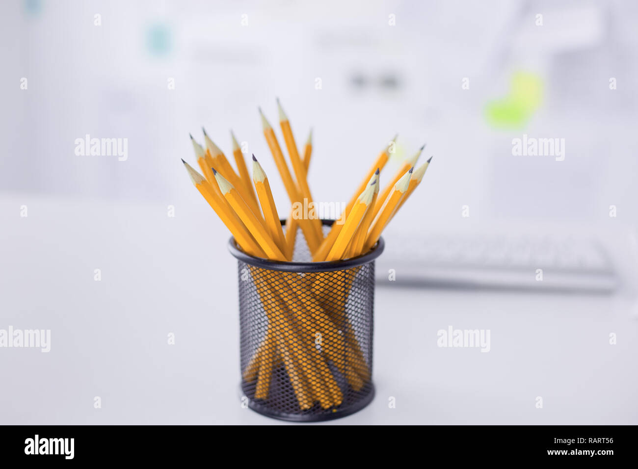 Graphite pencils in a metal grid-container. Concept Stock Photo - Alamy