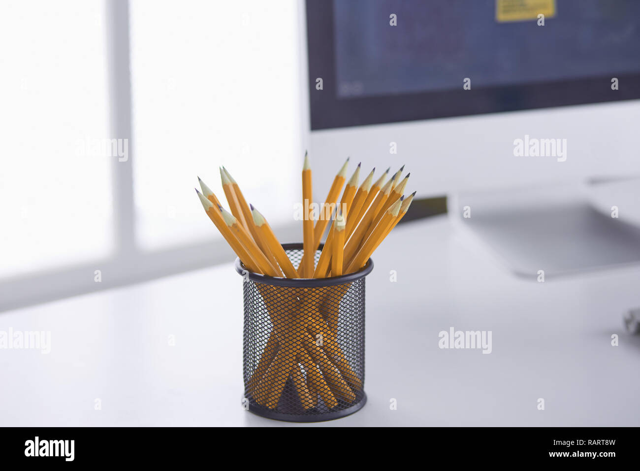 Graphite pencils in a metal grid-container. Concept Stock Photo - Alamy