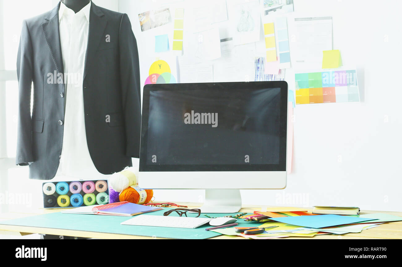 Empty workroom and workplace of tailor or vendor of clothes in small ...