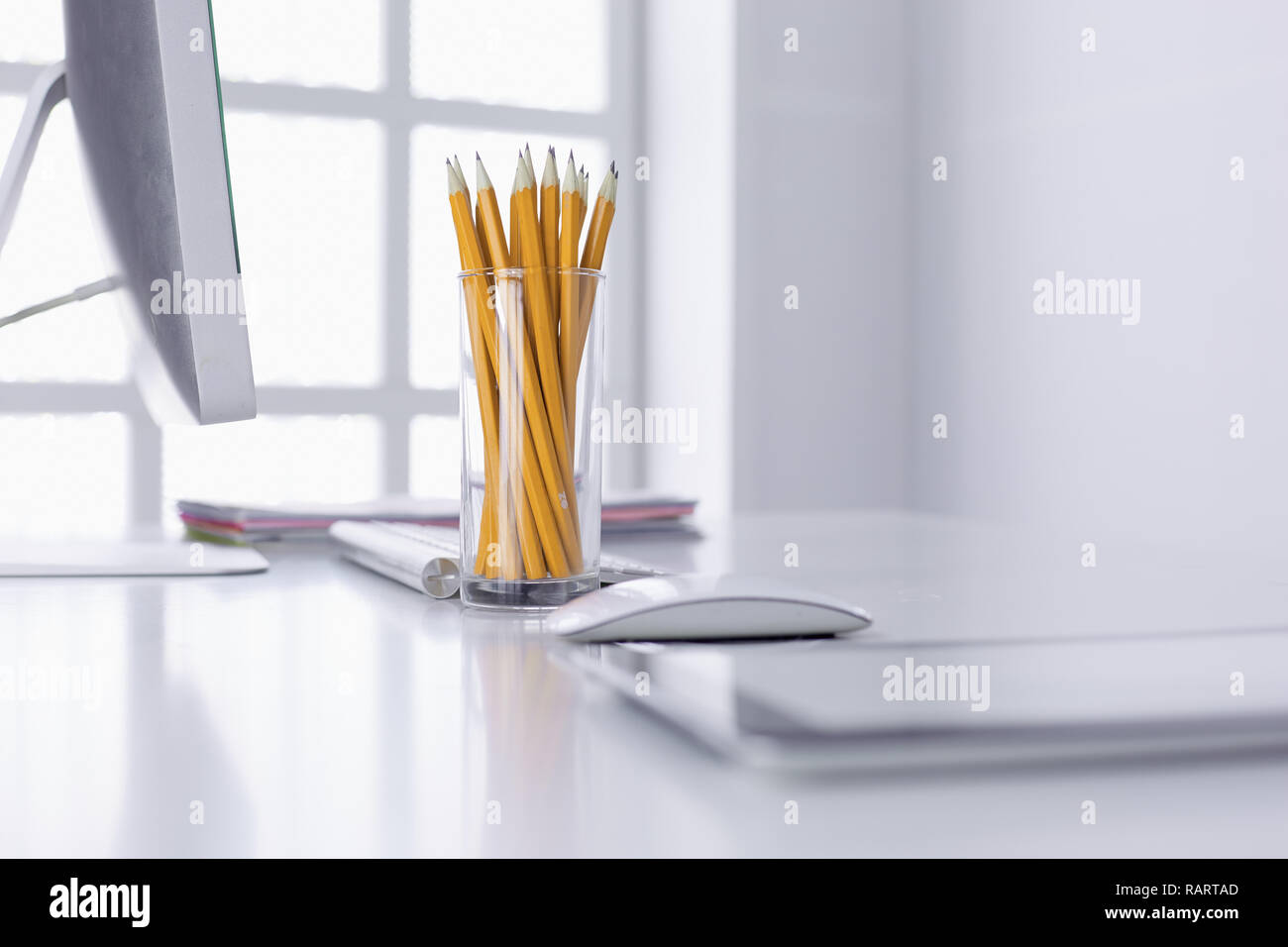 Graphite pencils in a glass cup on the office table. Concept Stock ...