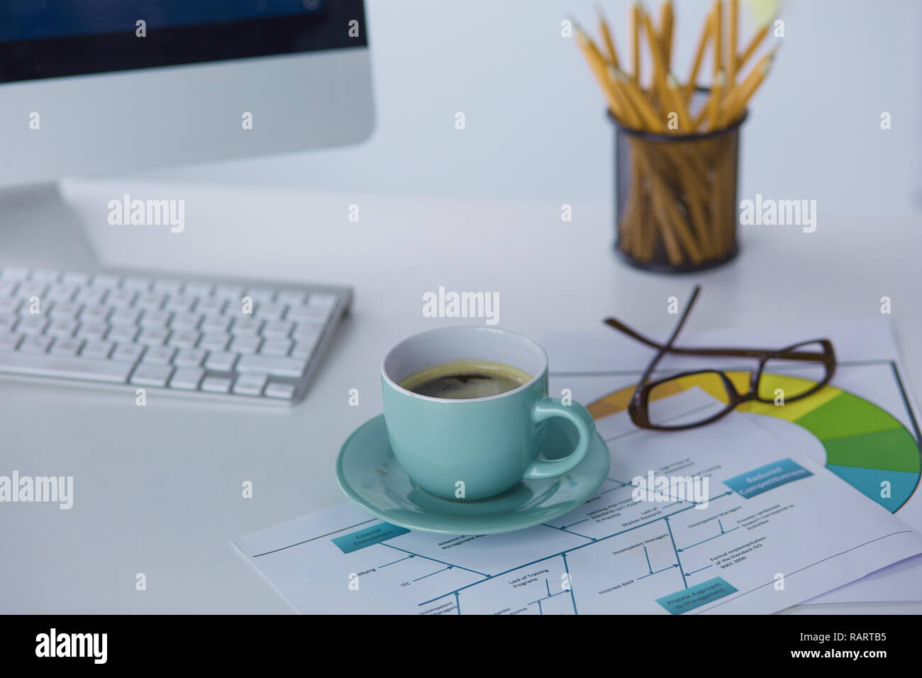 A cup of coffee on the office table Stock Photo - Alamy