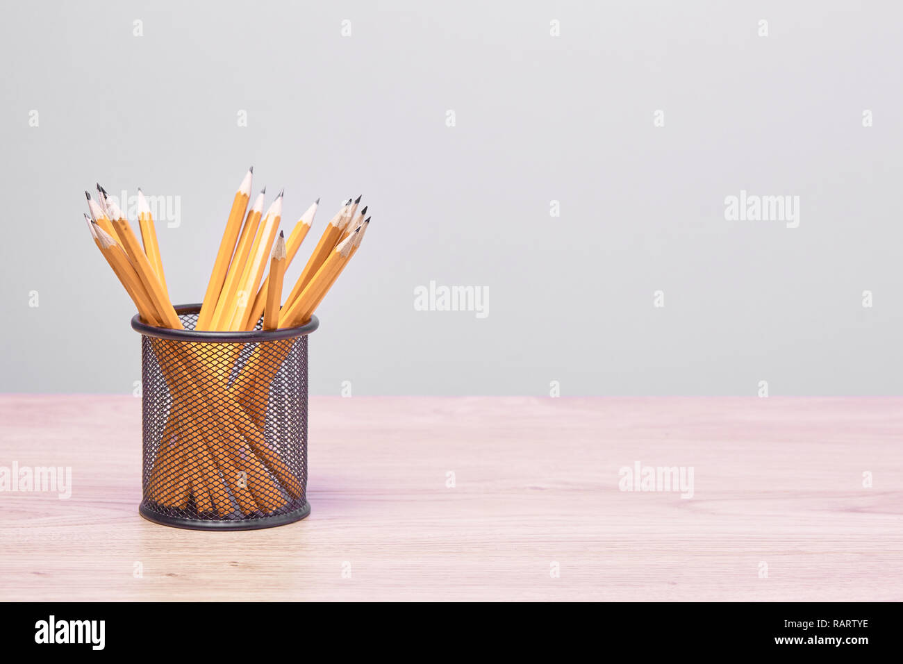 Graphite pencils in a metal grid-container. Concept Stock Photo - Alamy