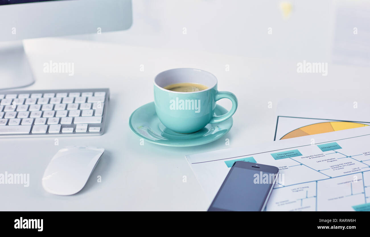 A cup of coffee on the office table Stock Photo - Alamy