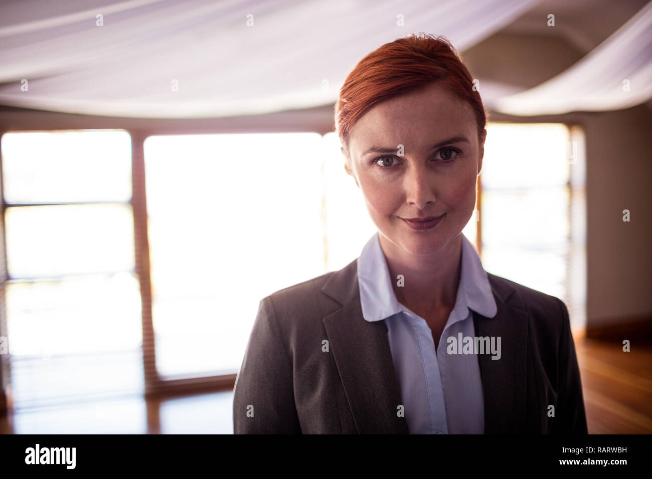 Female manager standing in hotel Stock Photo - Alamy