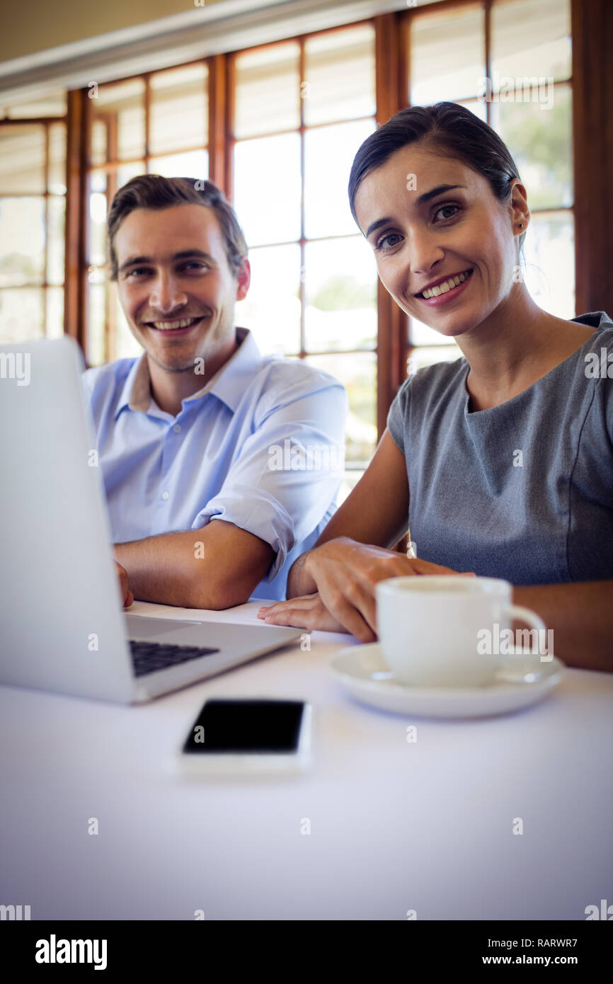 Business people looking at camera in restaurant Stock Photo - Alamy