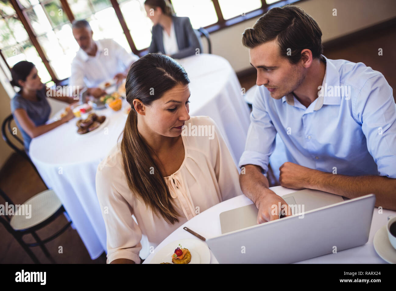 Couple table touching hi-res stock photography and images - Alamy