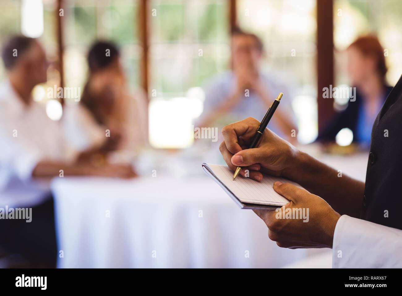 Waitress writing ordering on notepad hi-res stock photography and ...